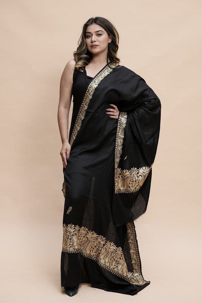 Black colour semi pashmina shawl enriched with ethnic heavy golden